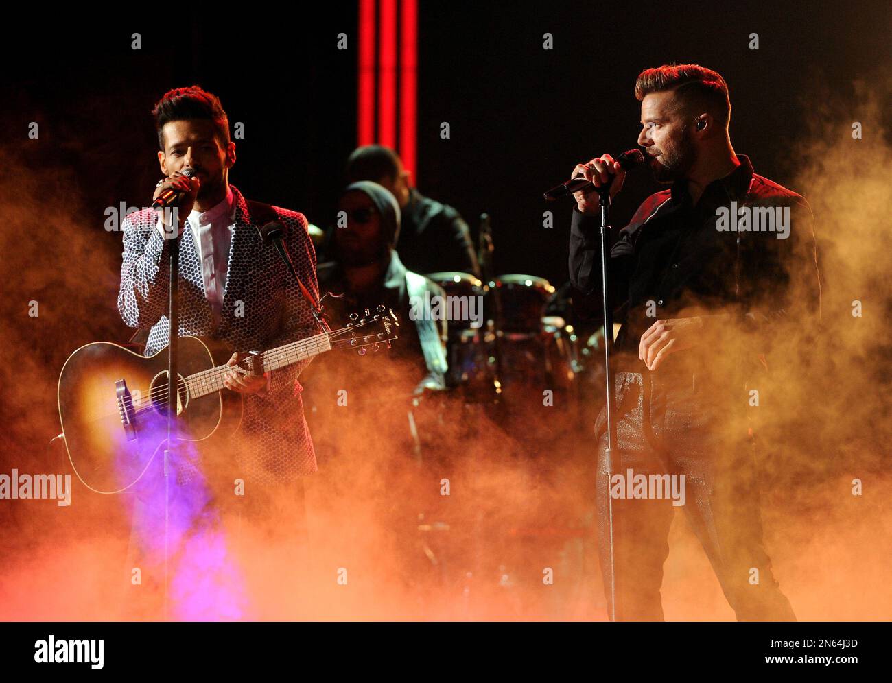 From left, musicians Draco Rosa and Ricky Martin perform onstage at the ...