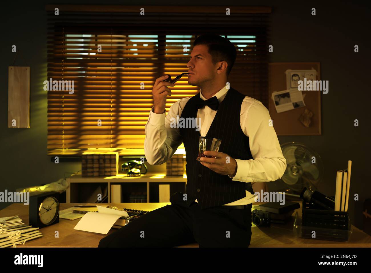 Old fashioned detective with drink and smoking pipe in office Stock ...
