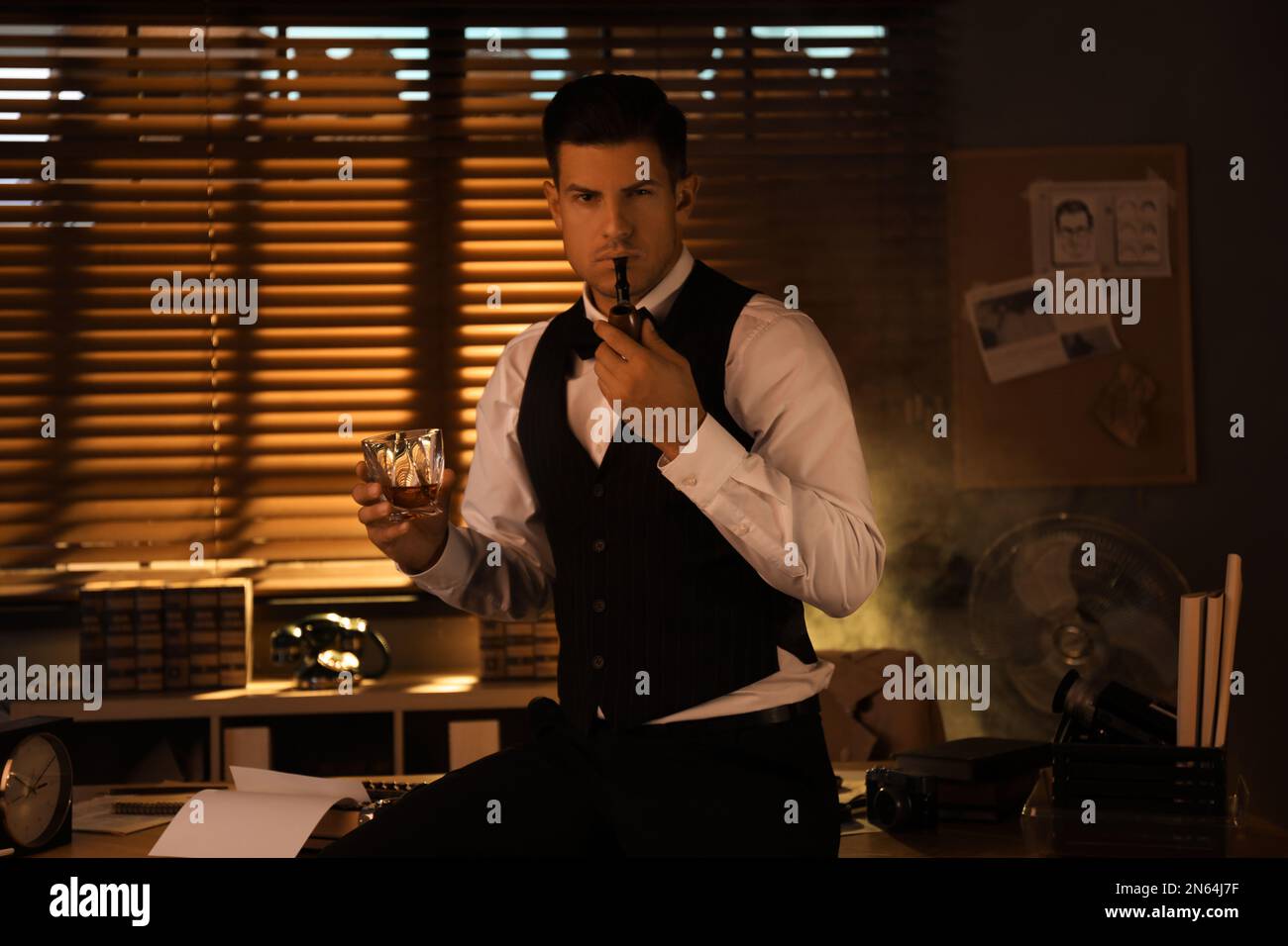 Old fashioned detective with drink and smoking pipe in office Stock ...
