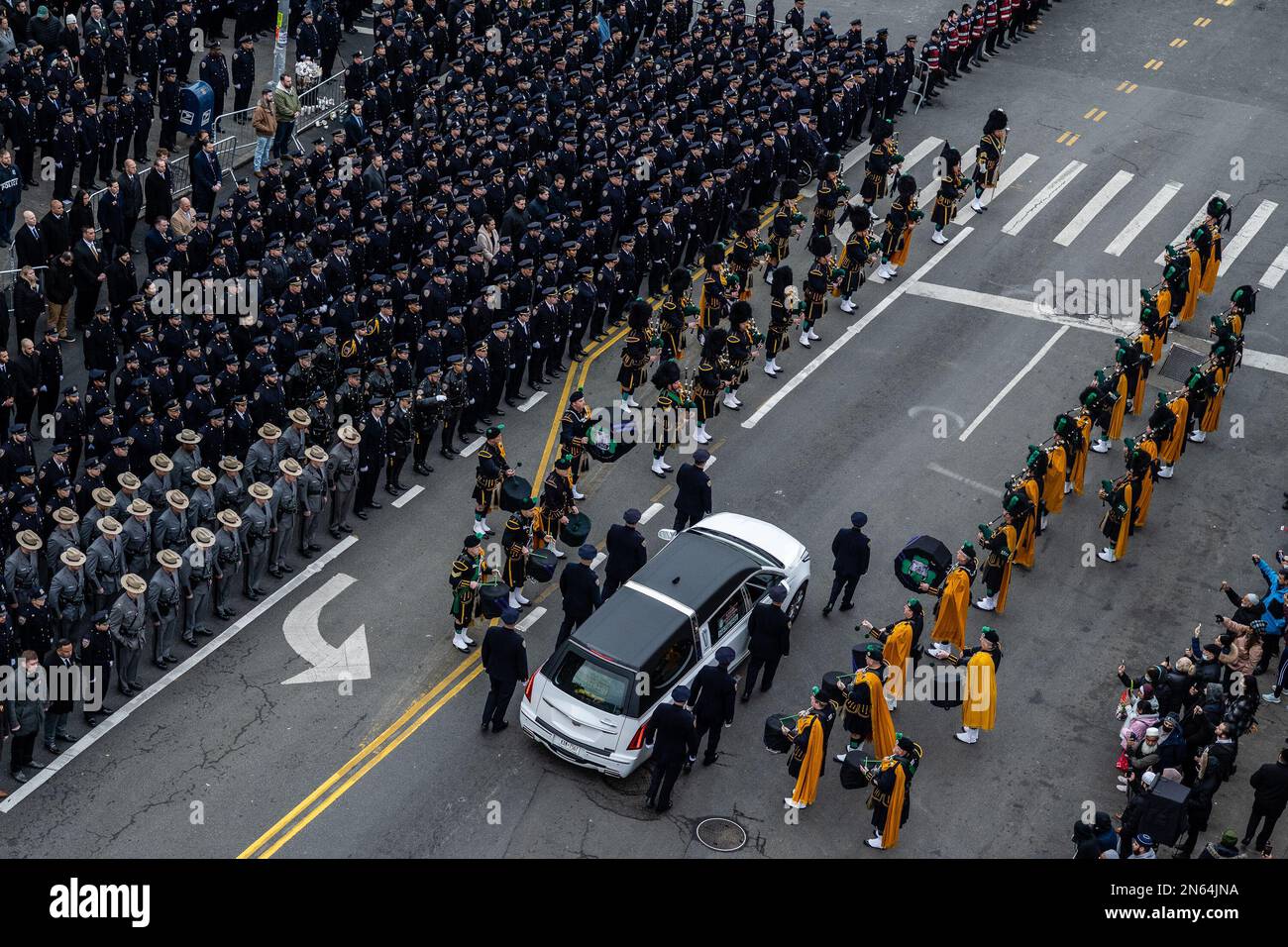 As the hearse with the casket of NYPD Officer Adeed Fayaz drives by ...