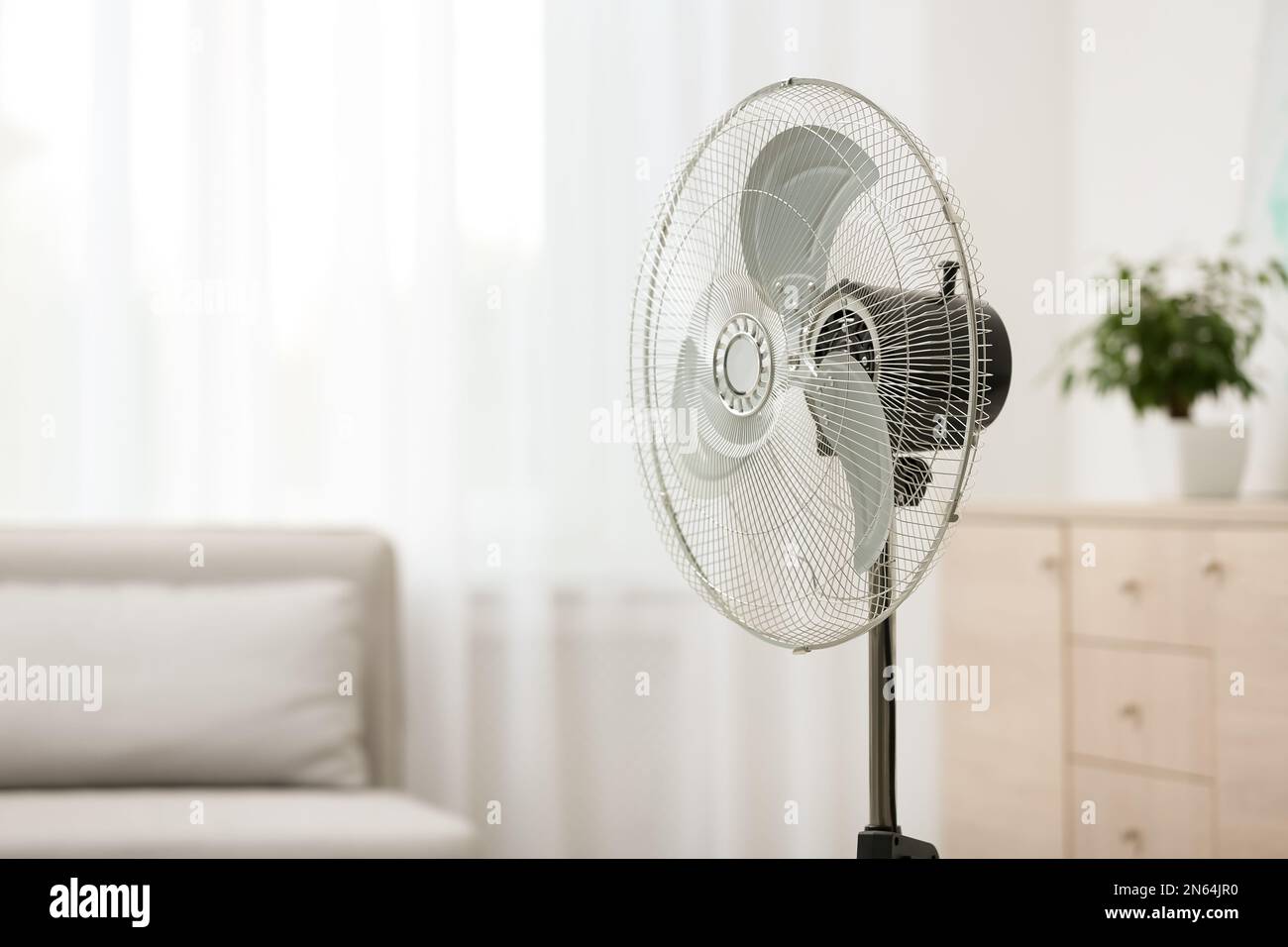 Modern electric fan in room. Space for text Stock Photo - Alamy