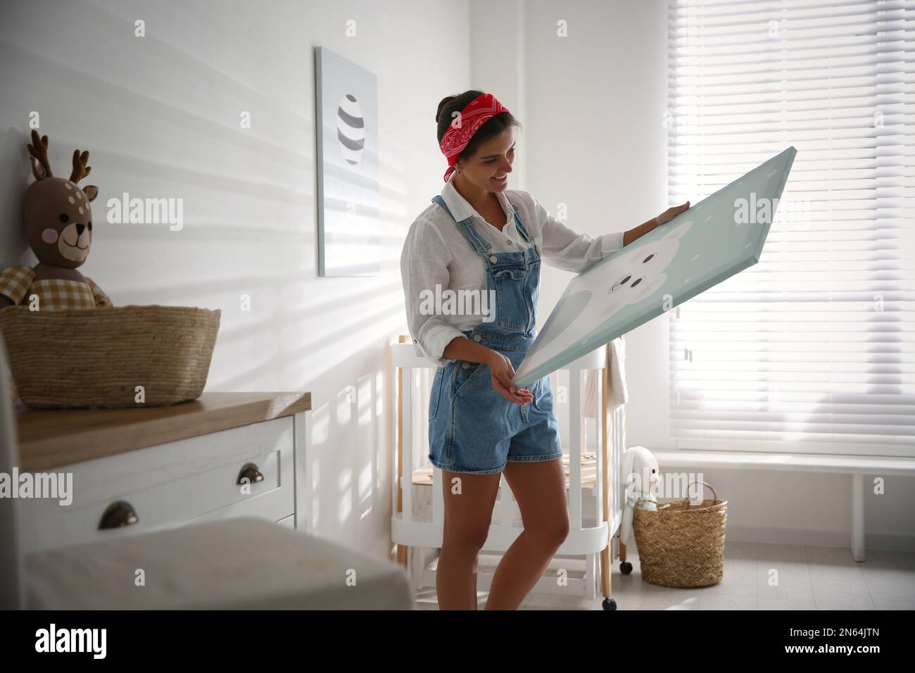 Decorator with picture in baby room. Interior design Stock Photo - Alamy