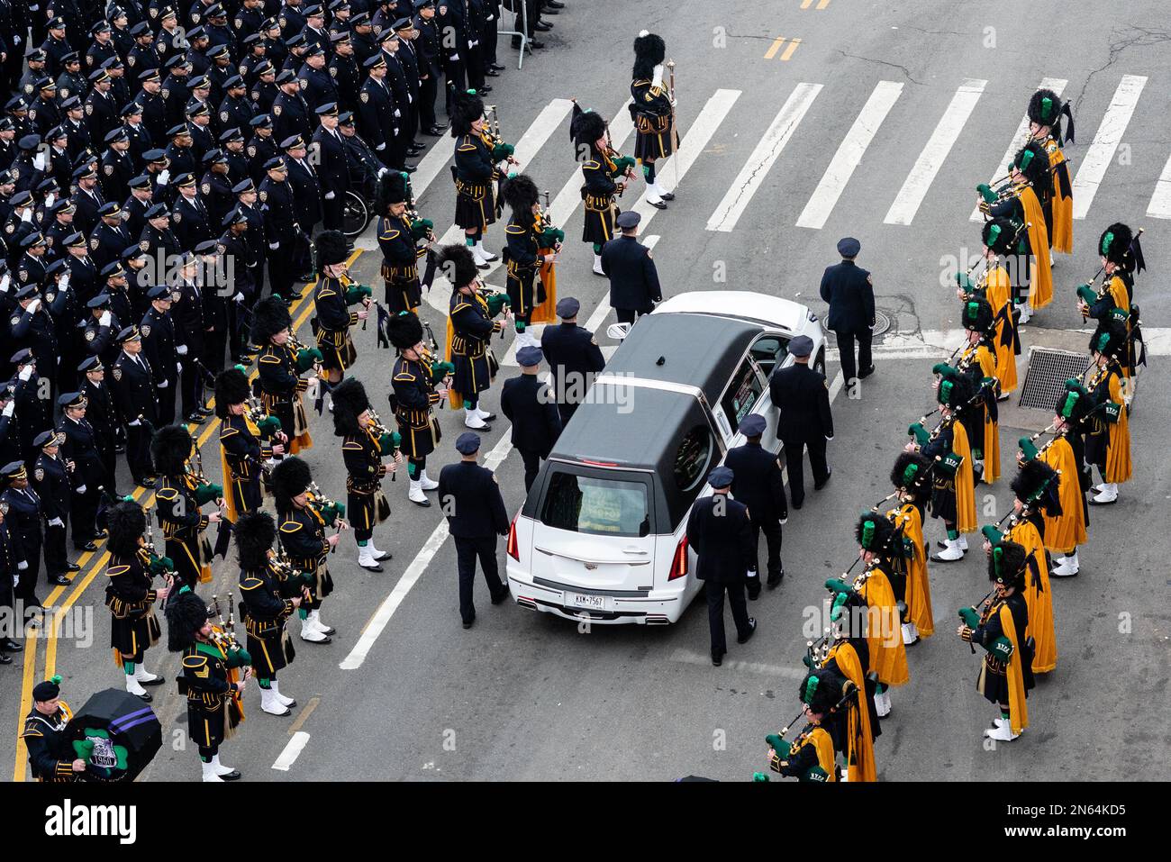 As the hearse with the casket of NYPD Officer Adeed Fayaz drives by ...