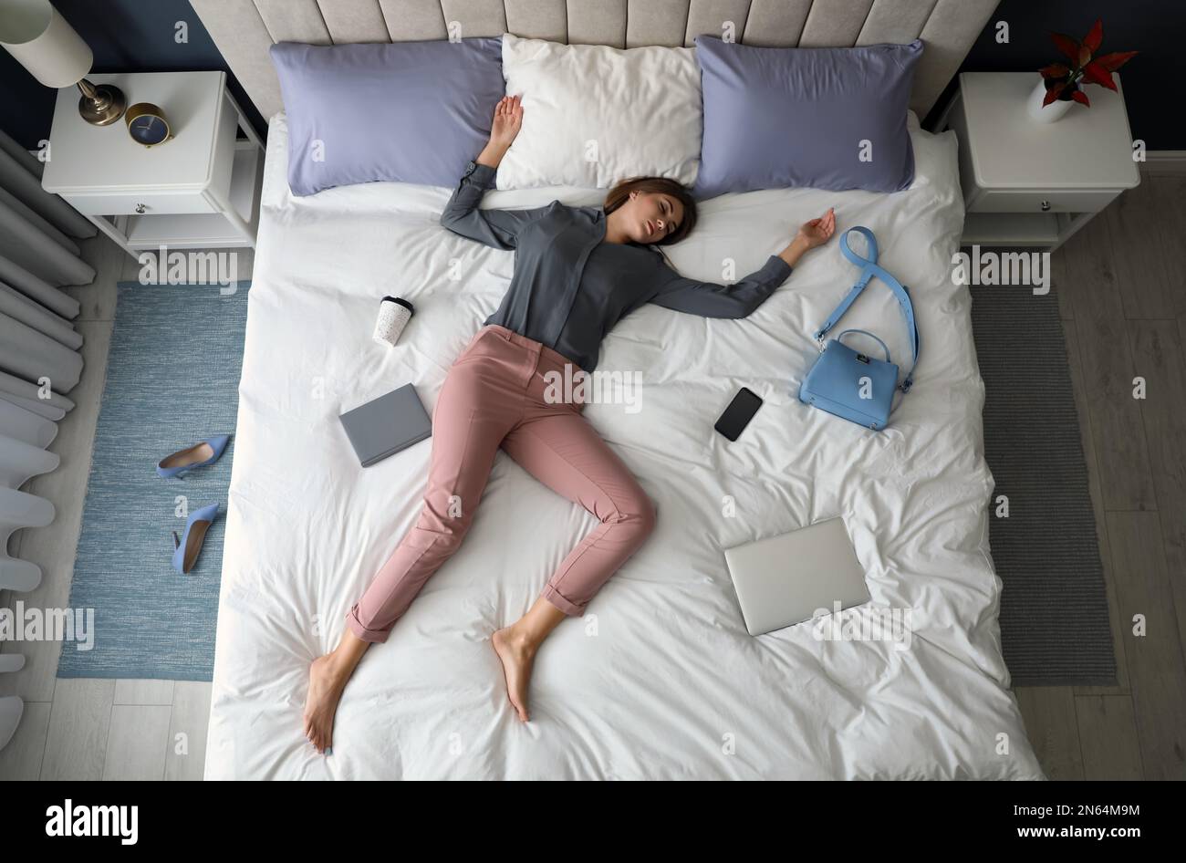 Fully dressed woman lying on bed hi-res stock photography and images ...