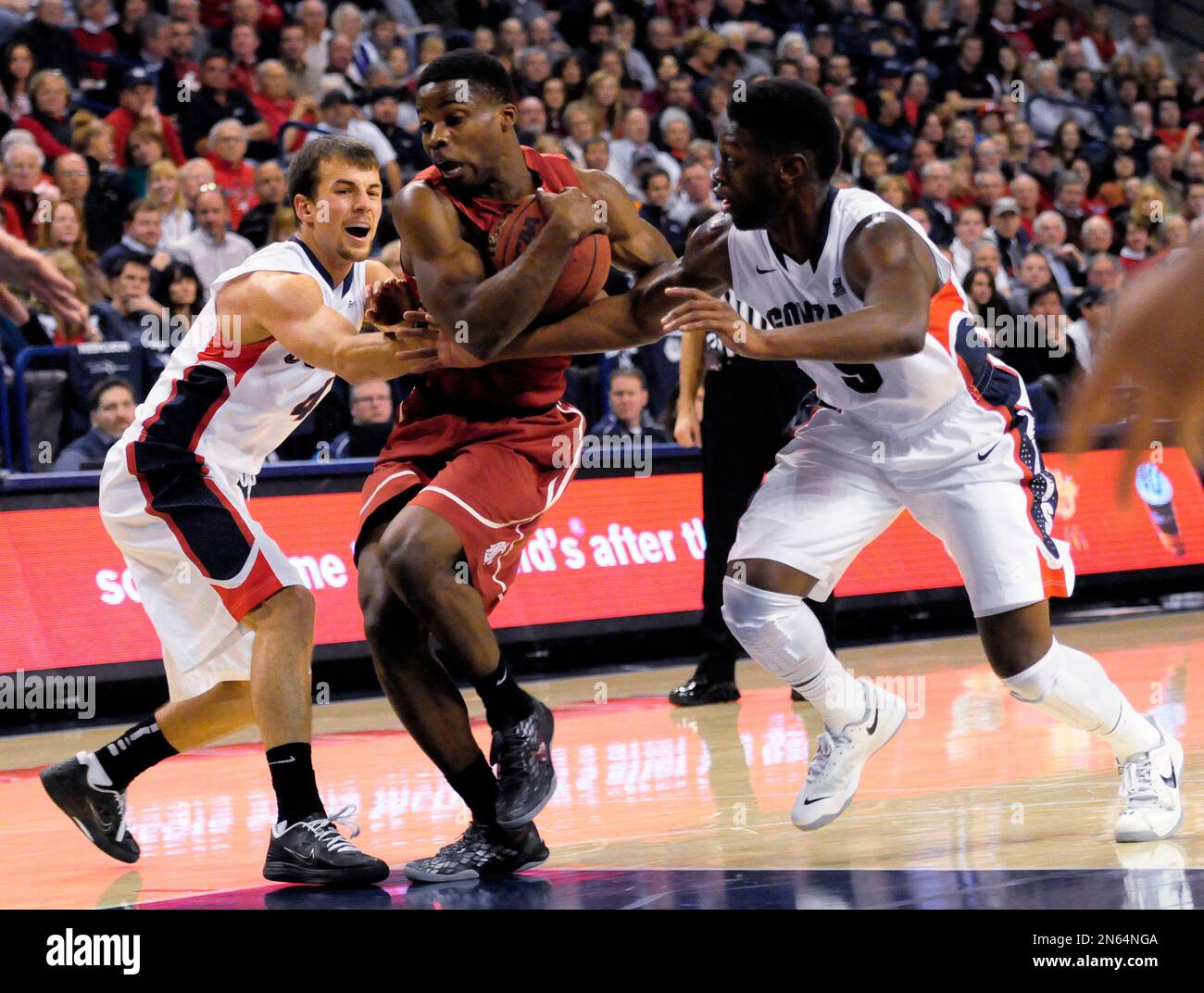 Gonzaga's Kevin Pangos, left, and Gary Bell Jr., right, defend ...