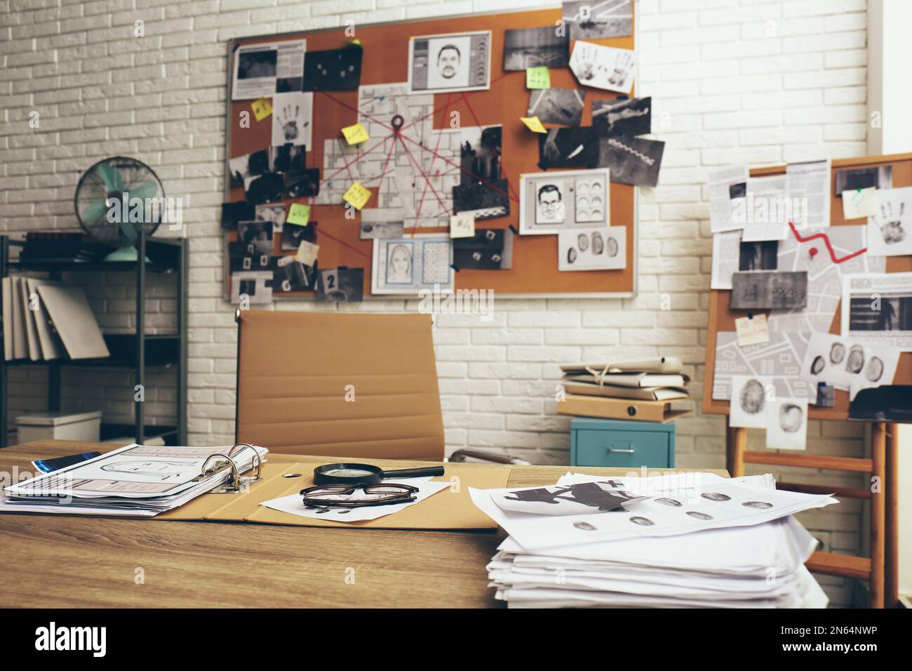 Modern detective office with workplace and board Stock Photo - Alamy