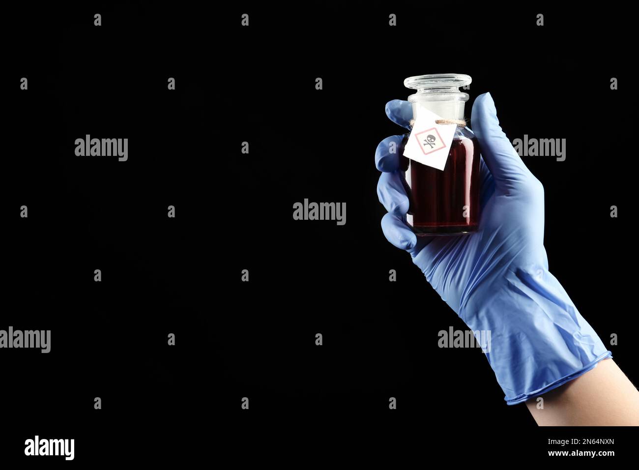 Hand holding bottle warning poison hi-res stock photography and images ...