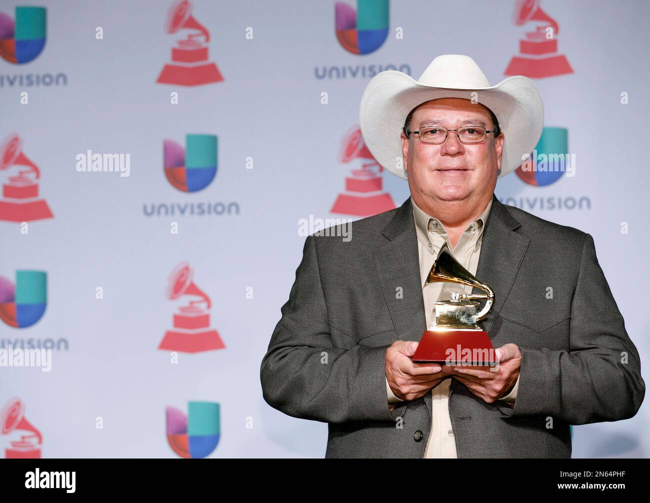 David Lee Garza poses backstage with the award for best Tejano album ...