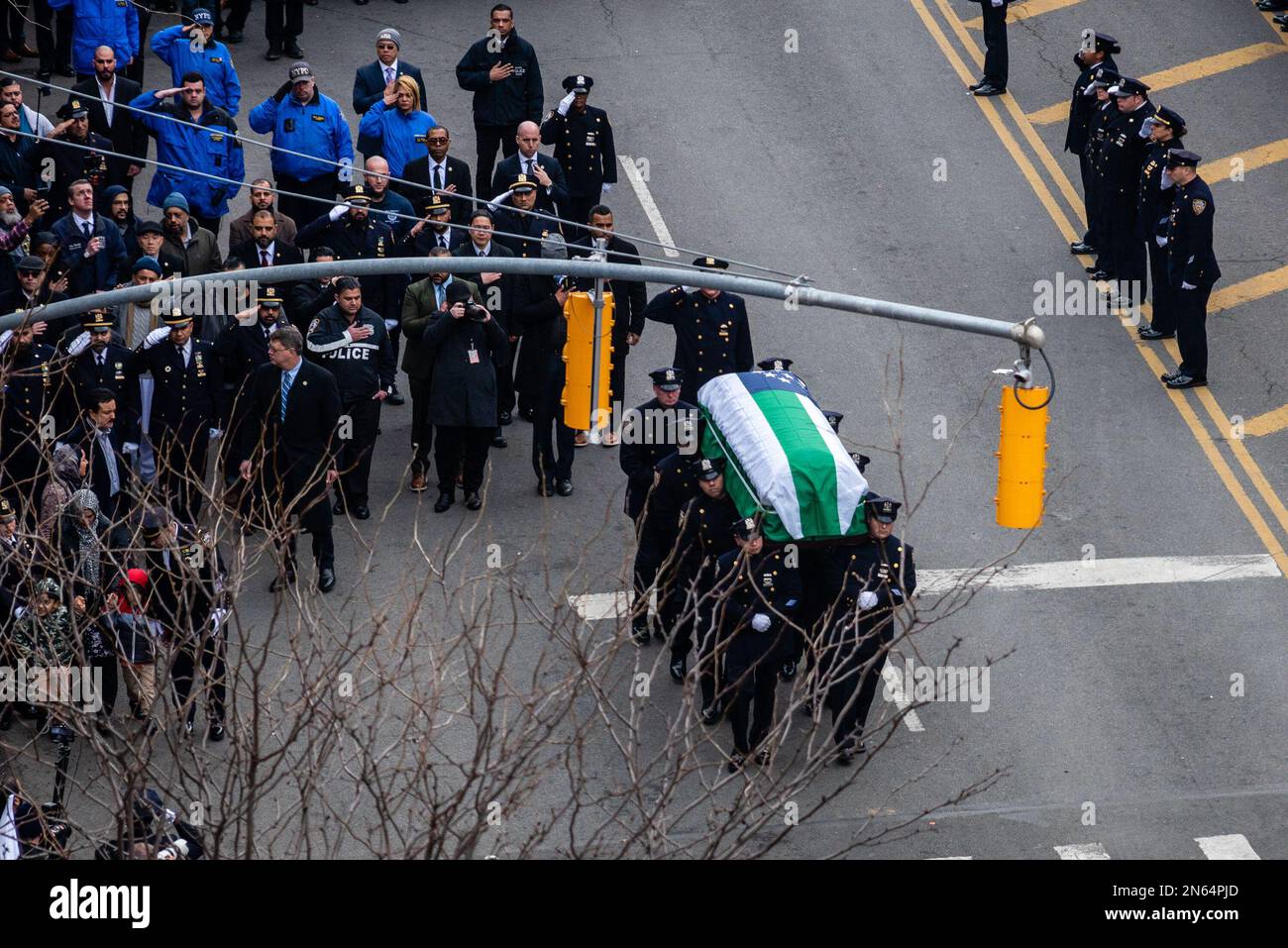 New York, USA. 09th Feb, 2023. NYPD officers carry the casket of NYPD ...