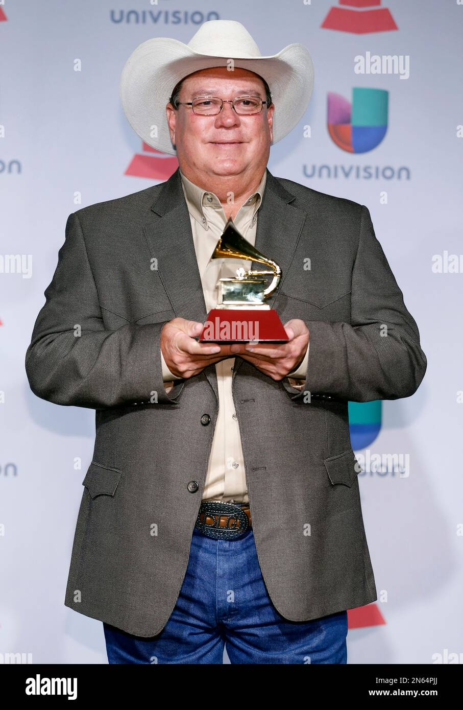 David Lee Garza poses backstage with the award for best Tejano album ...