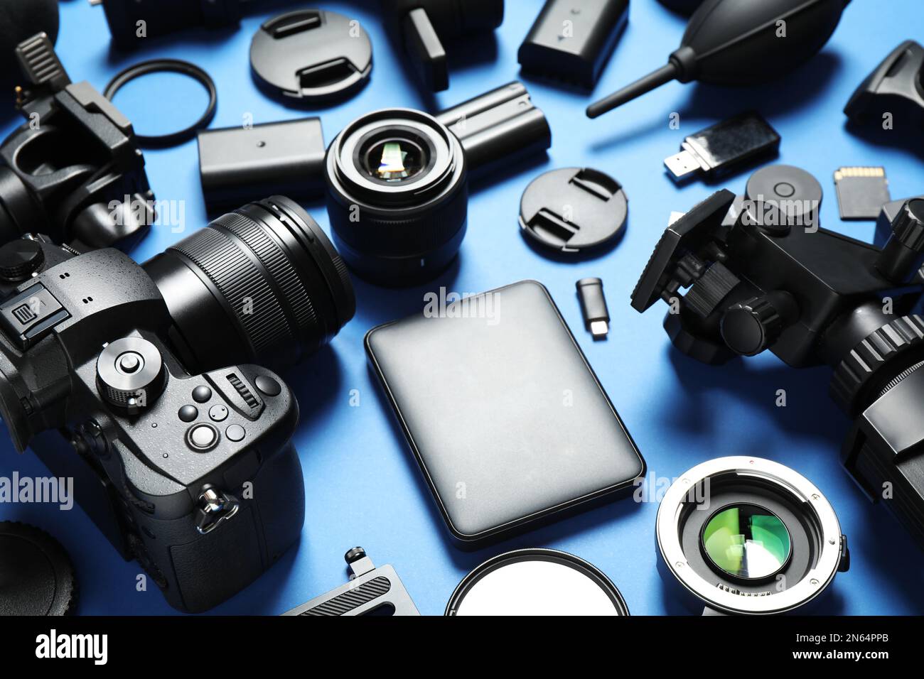 Camera and video production equipment on blue background Stock Photo ...