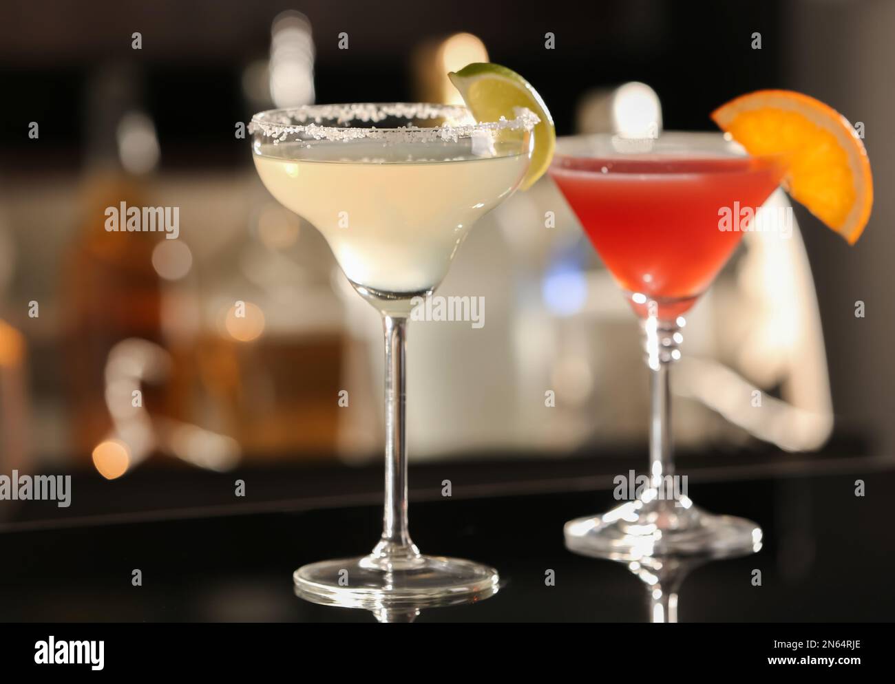 Different delicious cocktails on counter in bar Stock Photo - Alamy