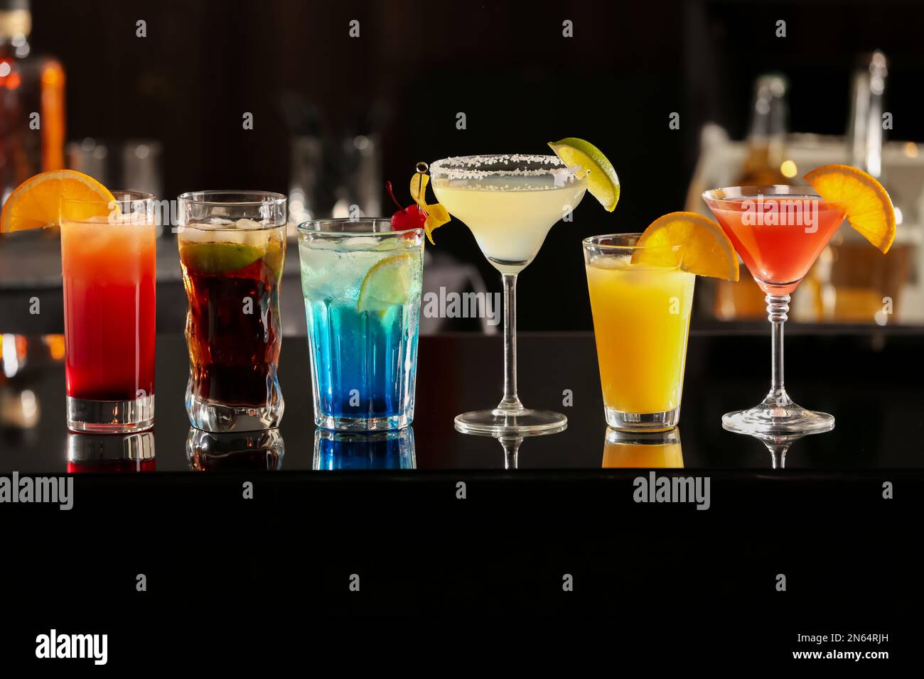Different delicious cocktails on counter in bar Stock Photo - Alamy