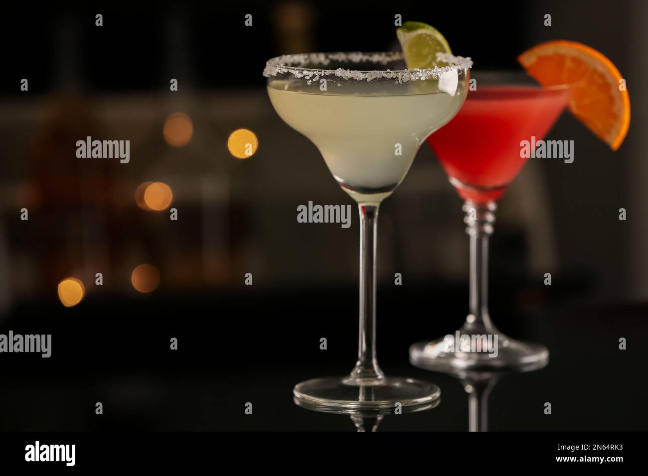 Different delicious cocktails on counter in bar Stock Photo - Alamy