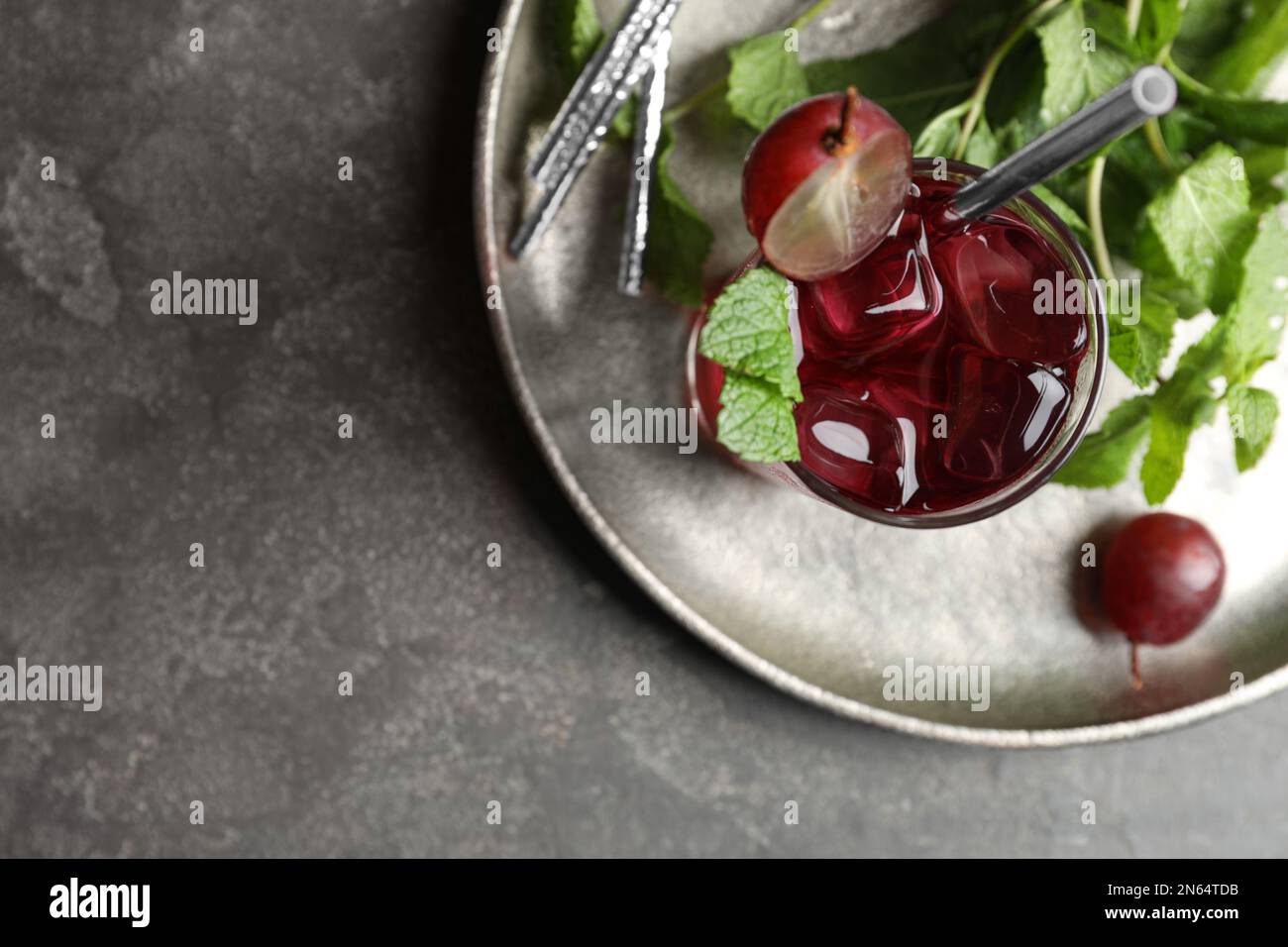 Delicious grape soda water with mint on grey table, top view. Refreshing drink Stock Photo - Alamy