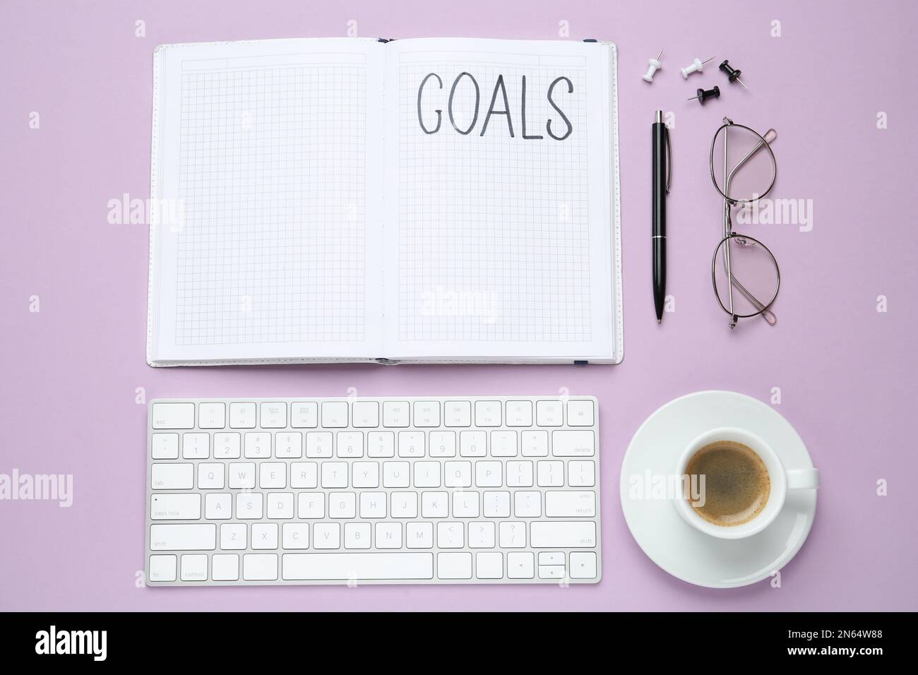 Flat lay composition with office stationery on violet background. Word ...