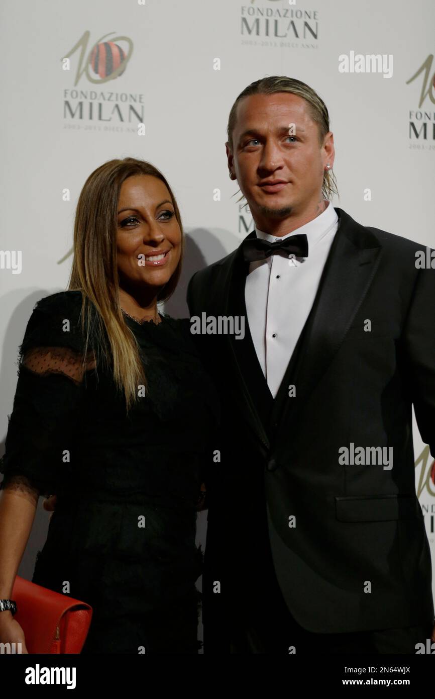 AC Milan defender Philippe Mexes, of France, is flanked by his wife ...