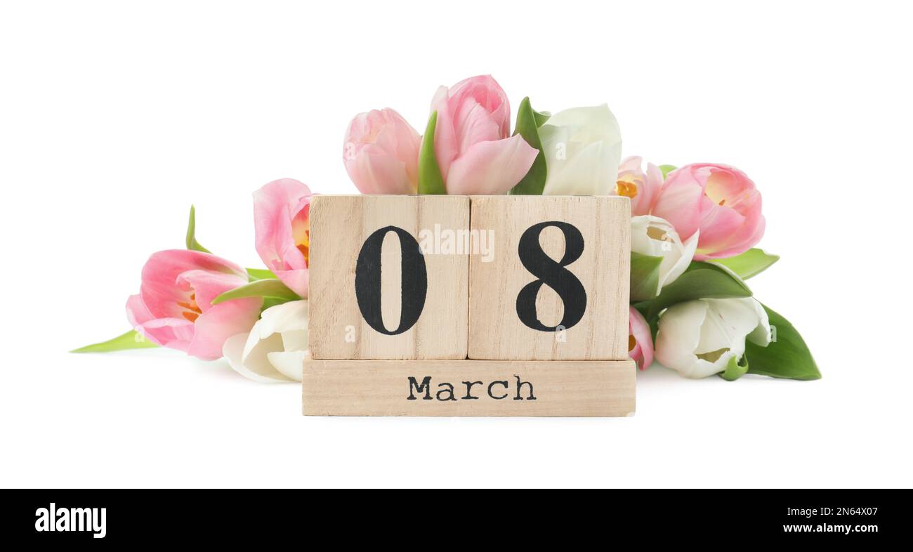 Wooden block calendar with date 8th of March and tulips on white ...