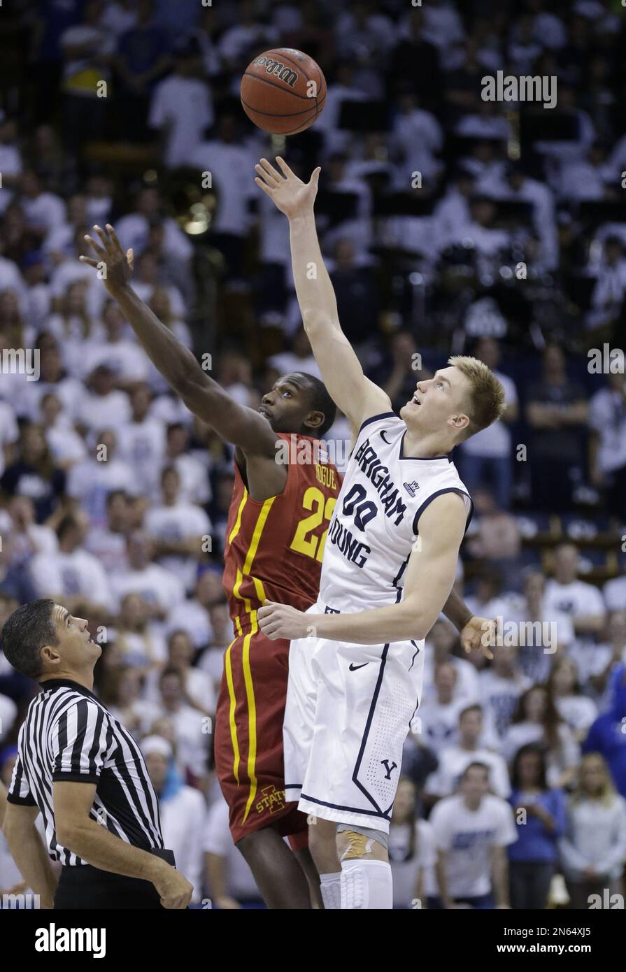 Brigham Young's Eric Mika (00) reaches for the tip off as Iowa State's ...