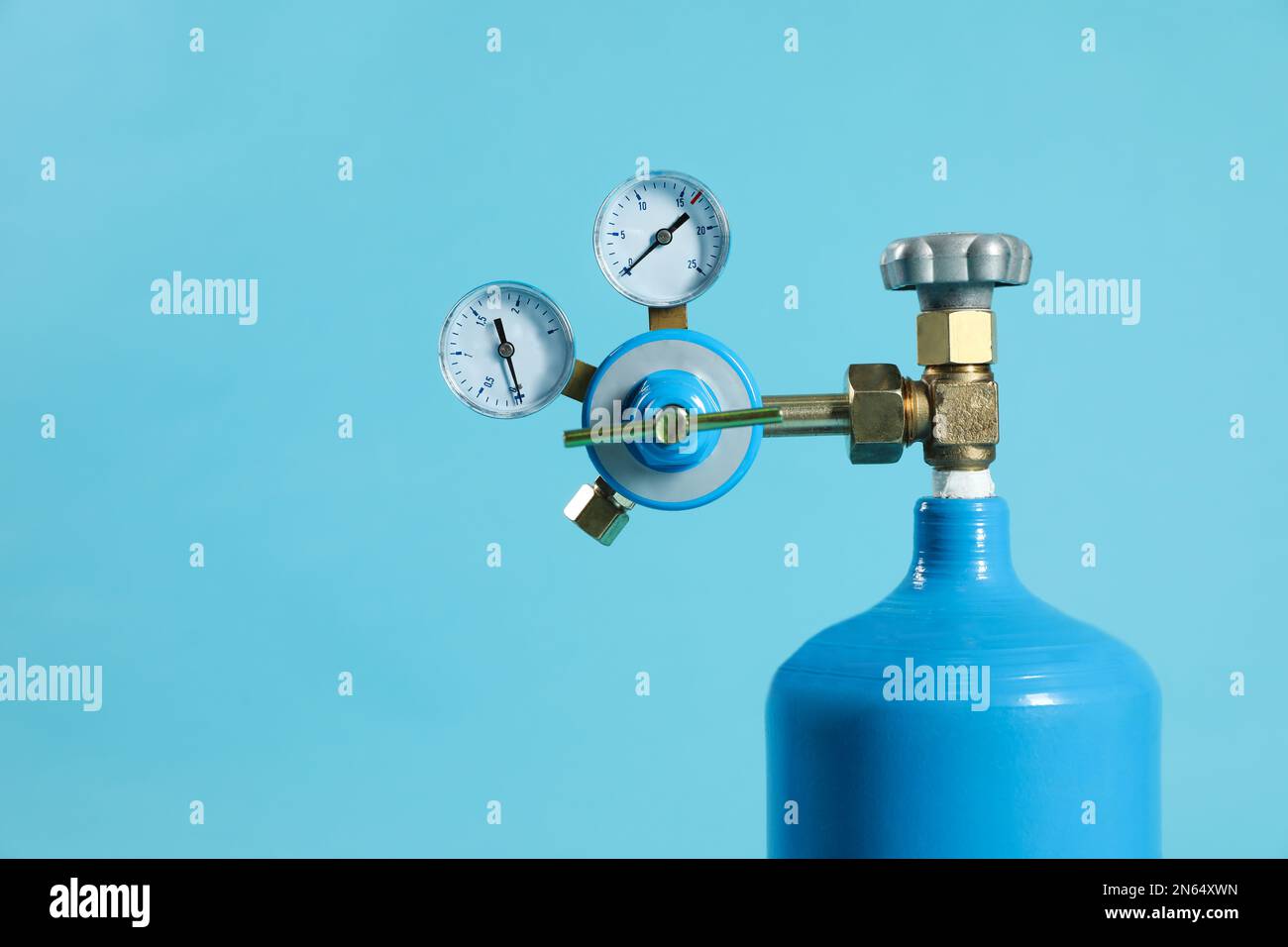Medical oxygen tank on light blue background. Space for text Stock ...