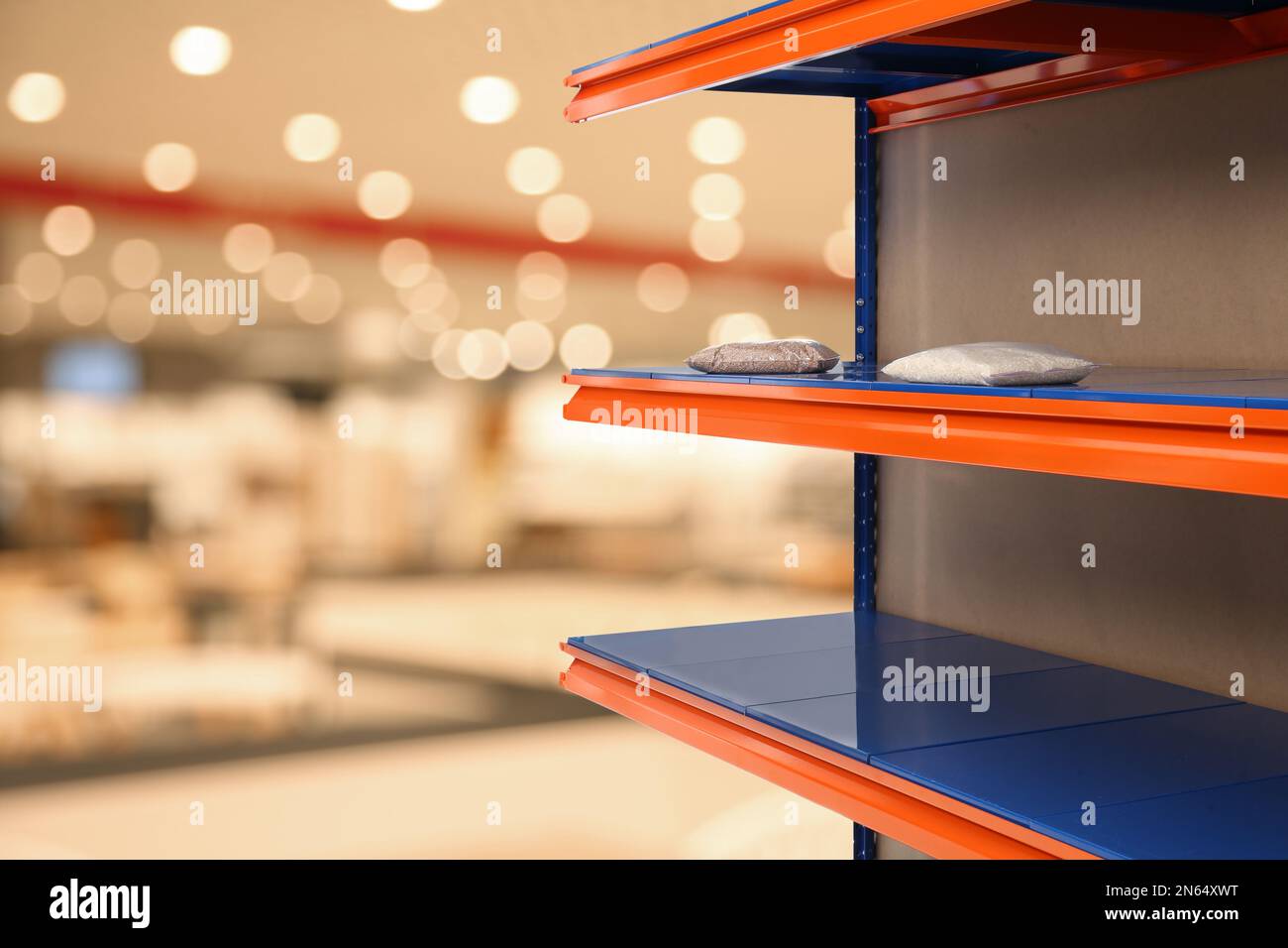 Almost empty shelves in supermarket, closeup. Product deficiency due to ...