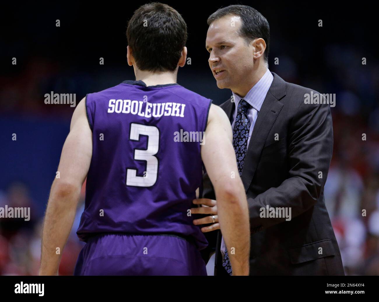 Northwestern head coach Chris Collins, right, talks to guard Dave ...