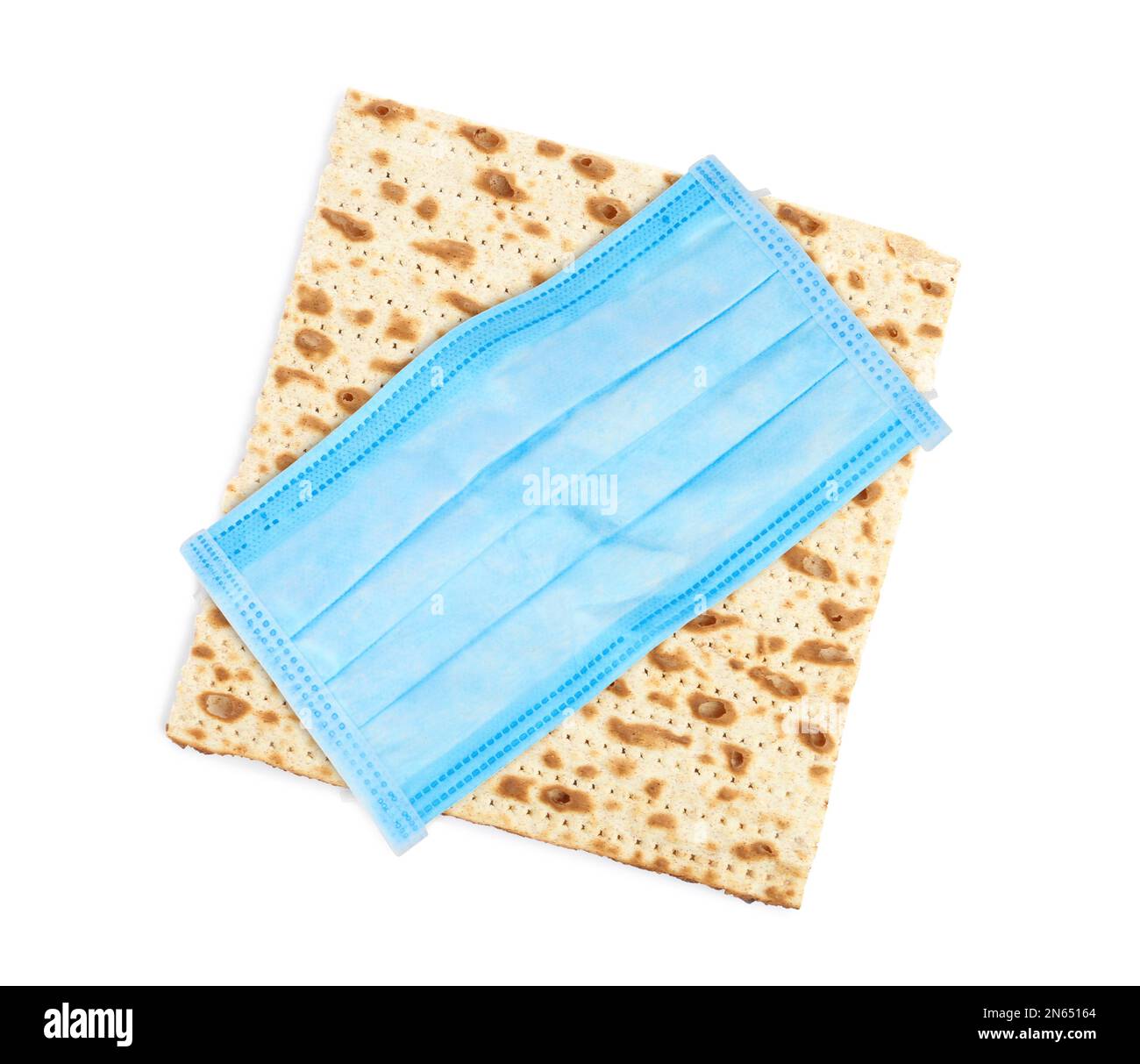 Coronavirus pandemic. Passover matzo and protective face mask on white ...