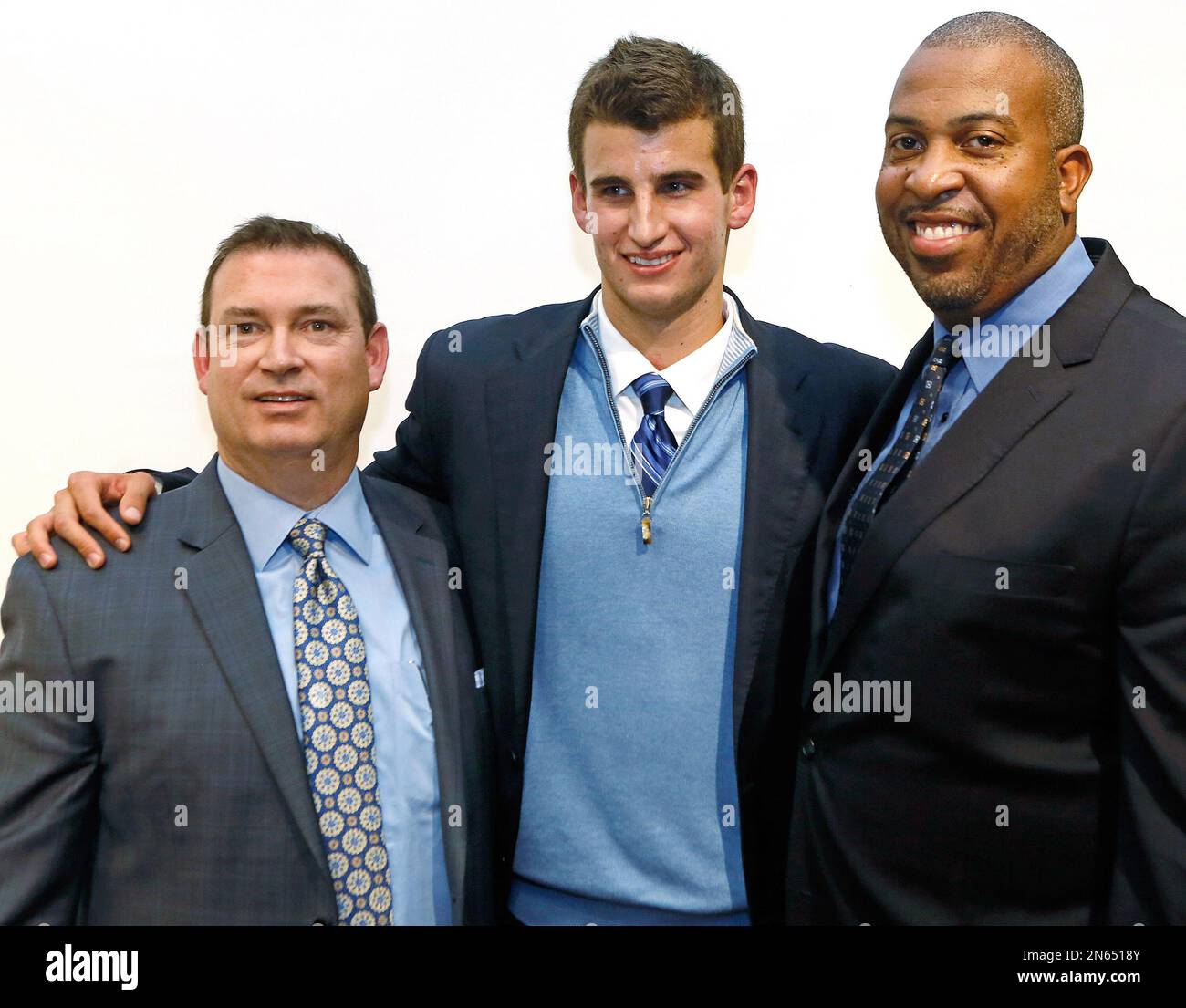 Loyola High School senior Austin Hatch, center, poses for a photo with ...