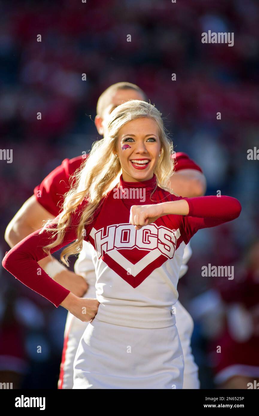 An Arkansas Razorback cheerleader performs before an NCAA college ...