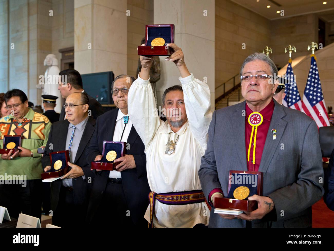 Representatives of American Indian tribes stand at a Congressional Gold ...