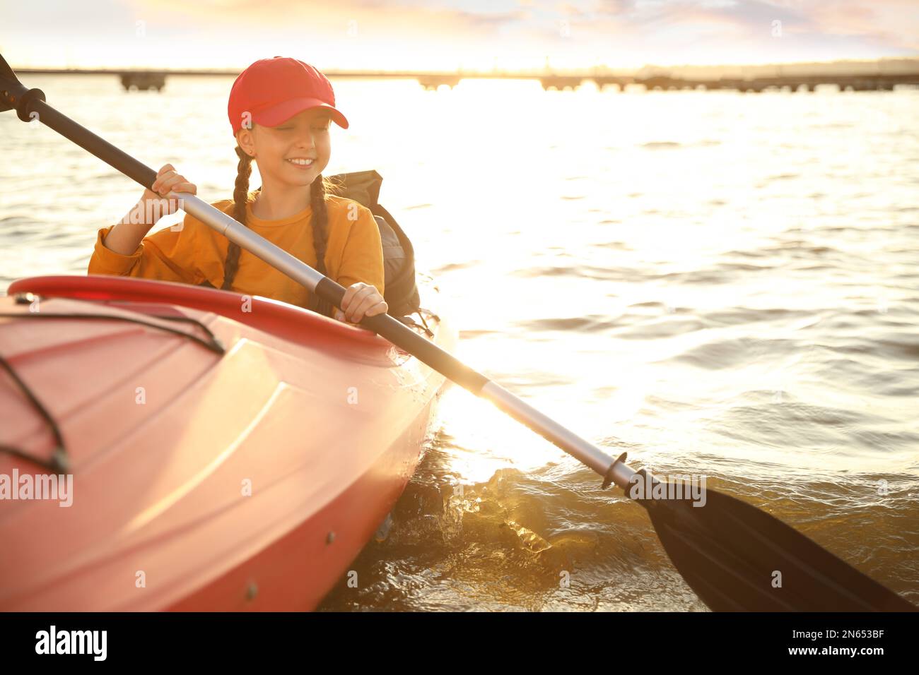 Happy girl kayaking on river. Summer camp activity Stock Photo - Alamy