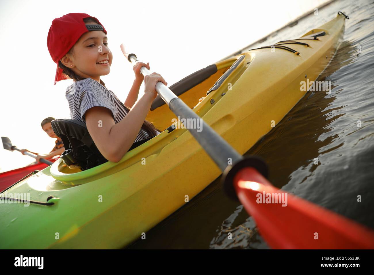 Little children kayaking on river. Summer camp activity Stock Photo - Alamy