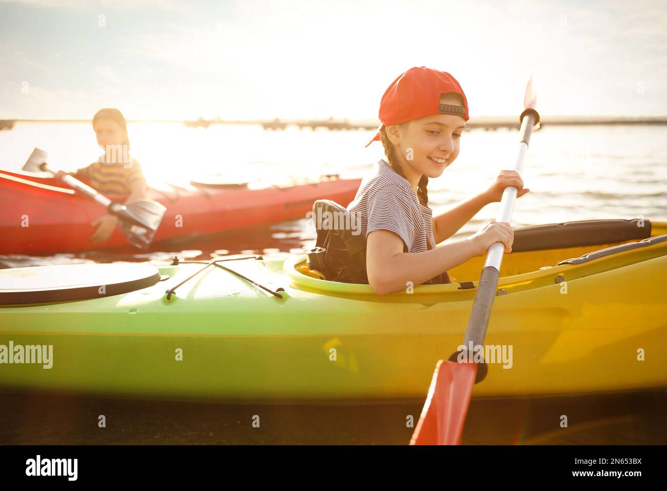Little children kayaking on river. Summer camp activity Stock Photo - Alamy
