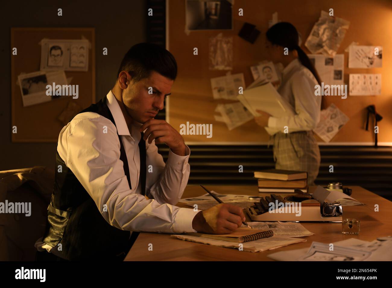 Old fashioned detective and his colleague working in office Stock Photo ...