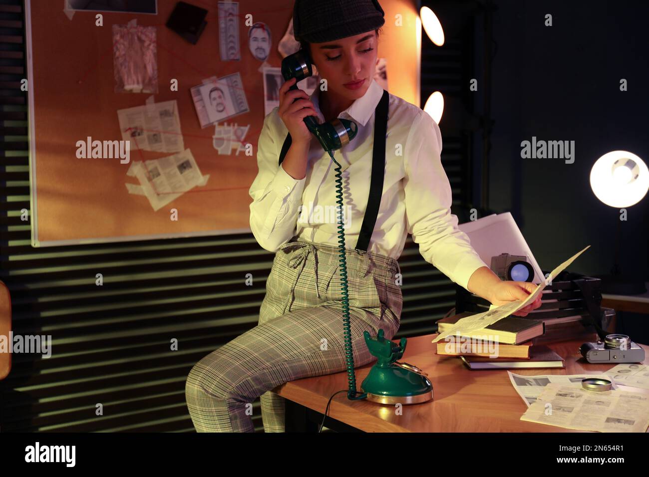 Old fashioned detective talking on phone in office Stock Photo - Alamy