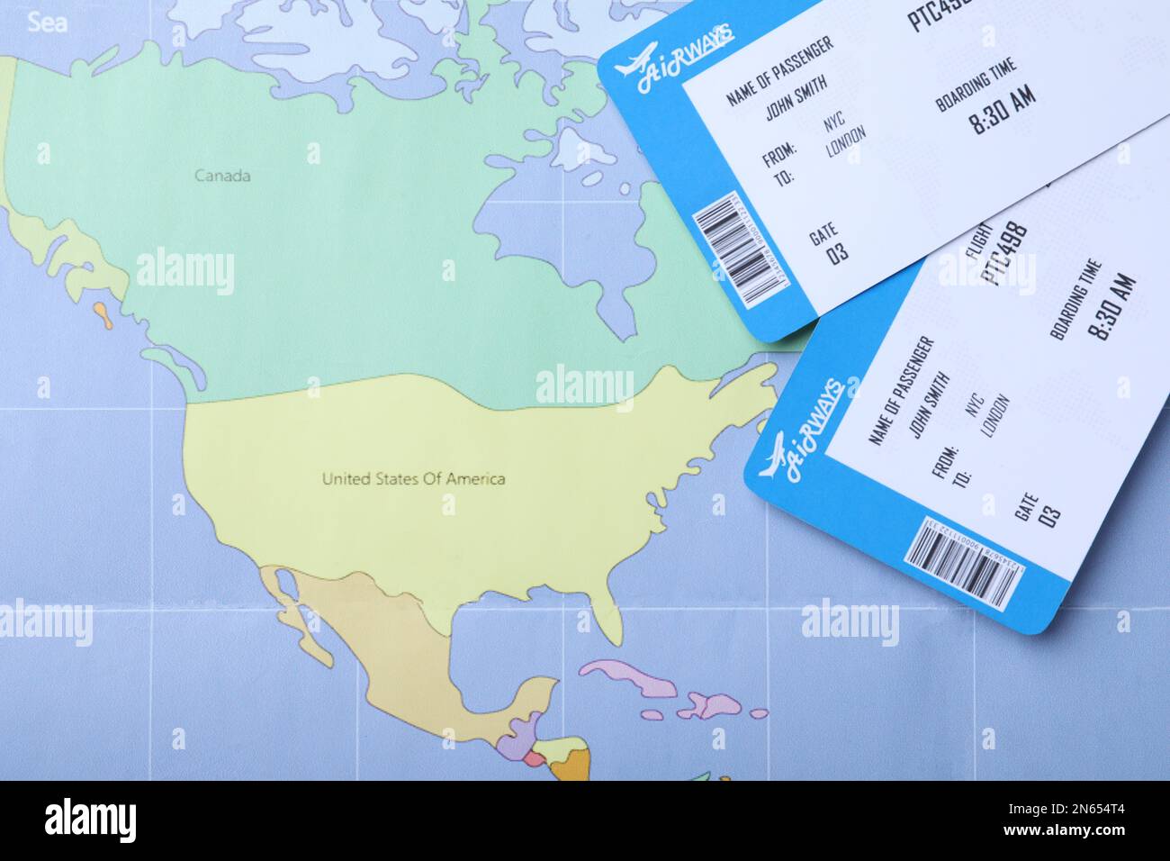 Tickets on world map, flat lay. Travel agency concept Stock Photo - Alamy