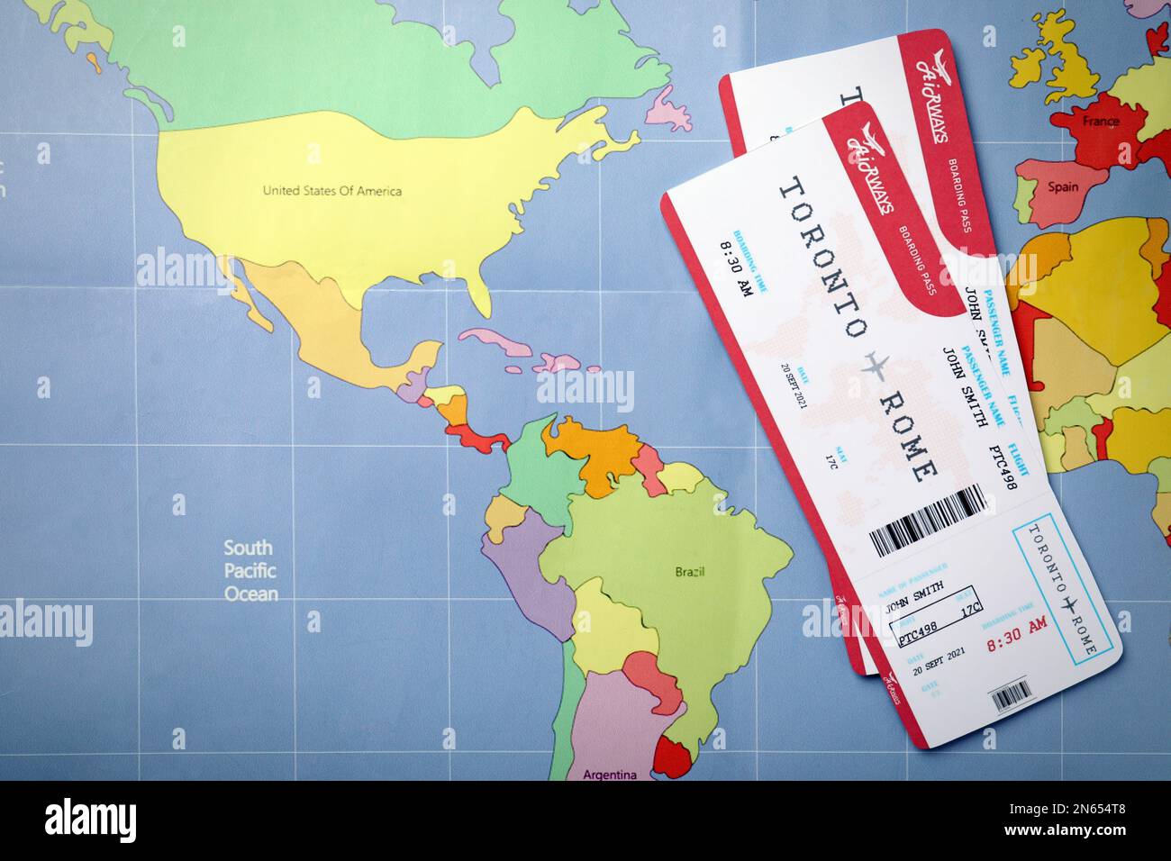 Tickets on world map, flat lay. Travel agency concept Stock Photo - Alamy