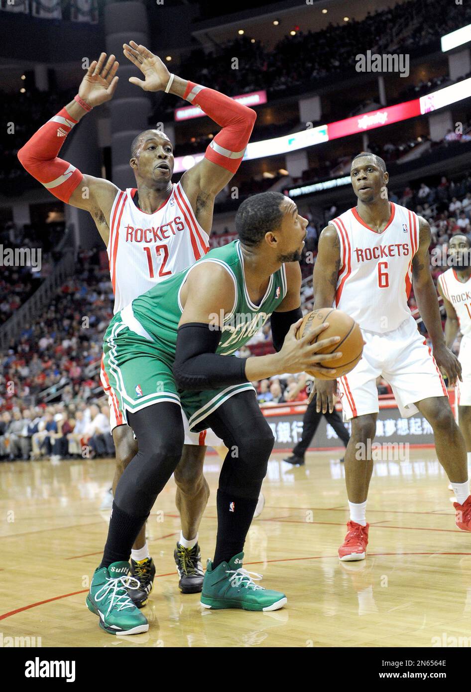 Boston Celtics' Jared Sullinger, center, looks to shoot as Houston ...