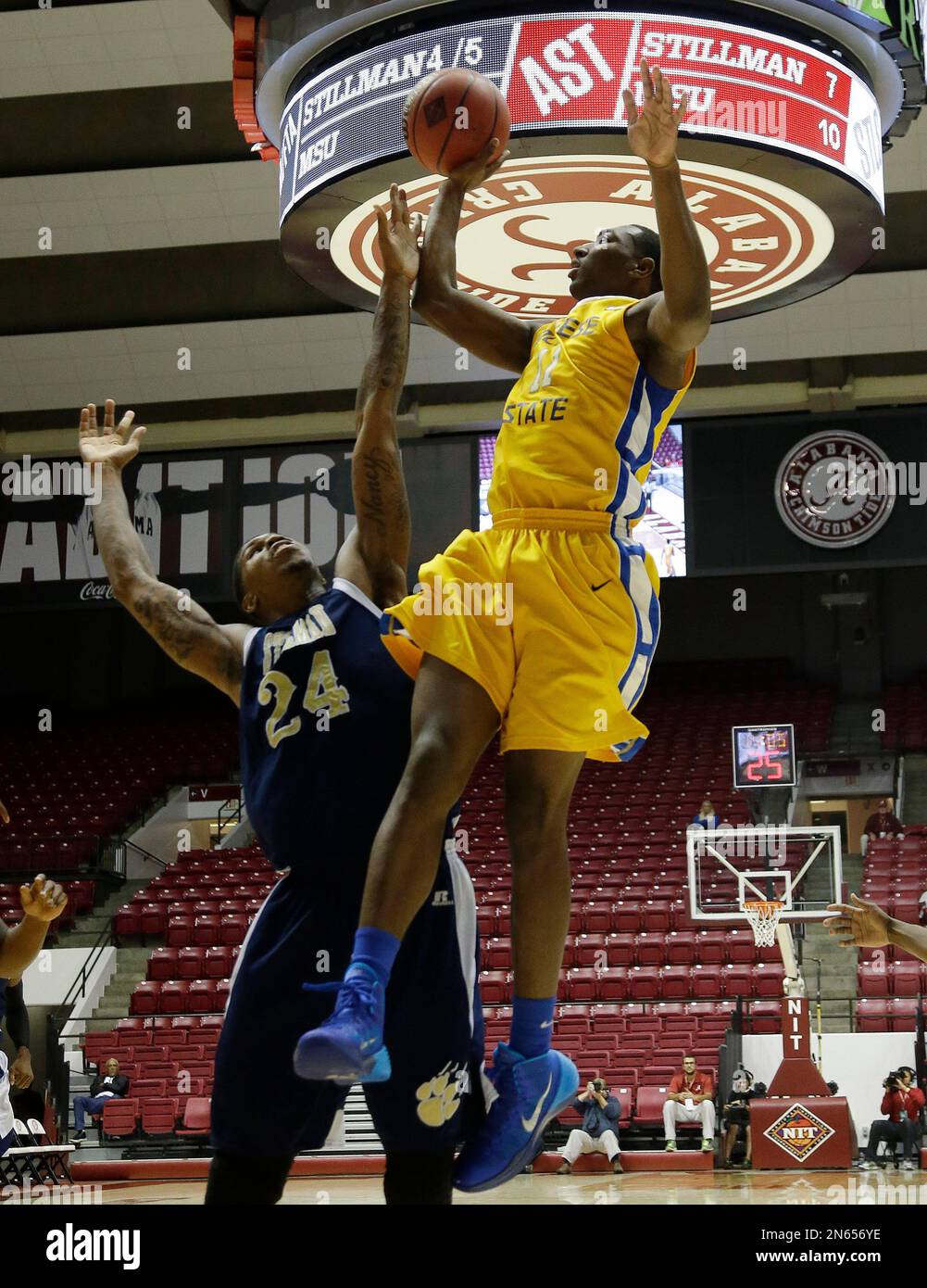 McNeese State guard Kevin Hardy (11) shoots over the defense of ...