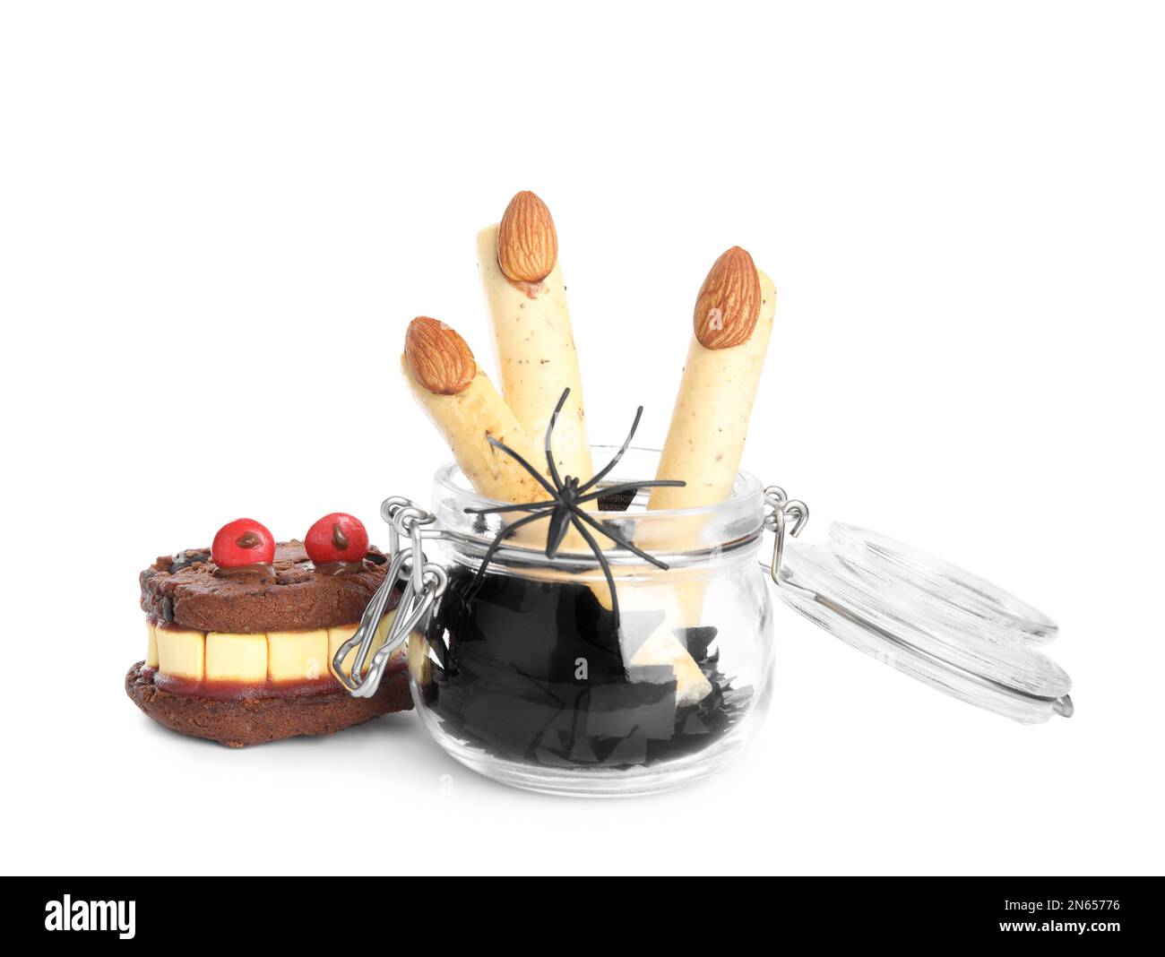 Delicious desserts decorated as monster fingers on white background ...