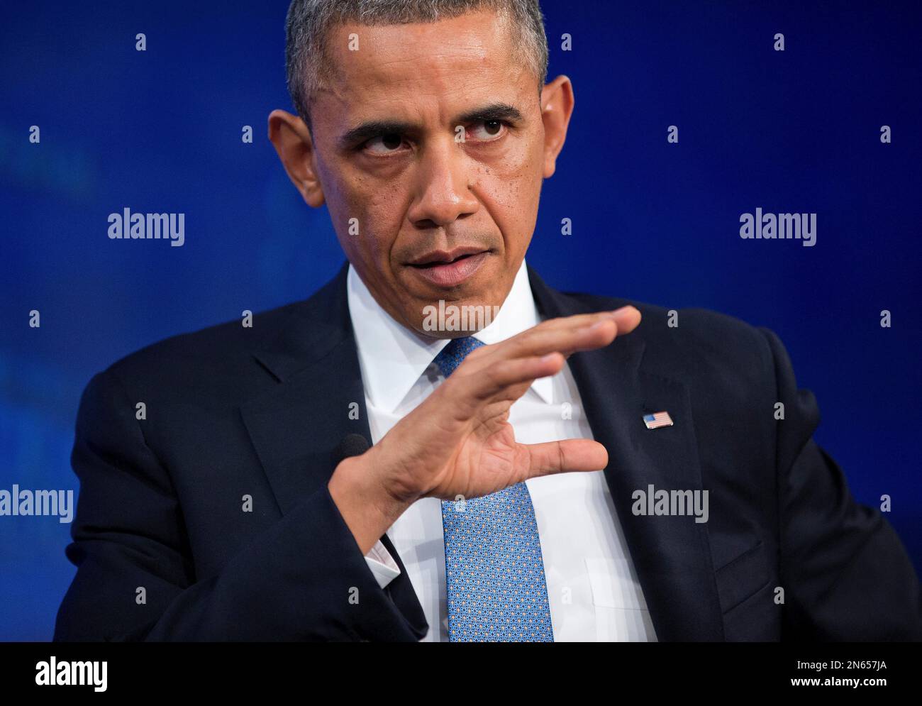 President Barack Obama gestures while speaking at the Wall Street ...