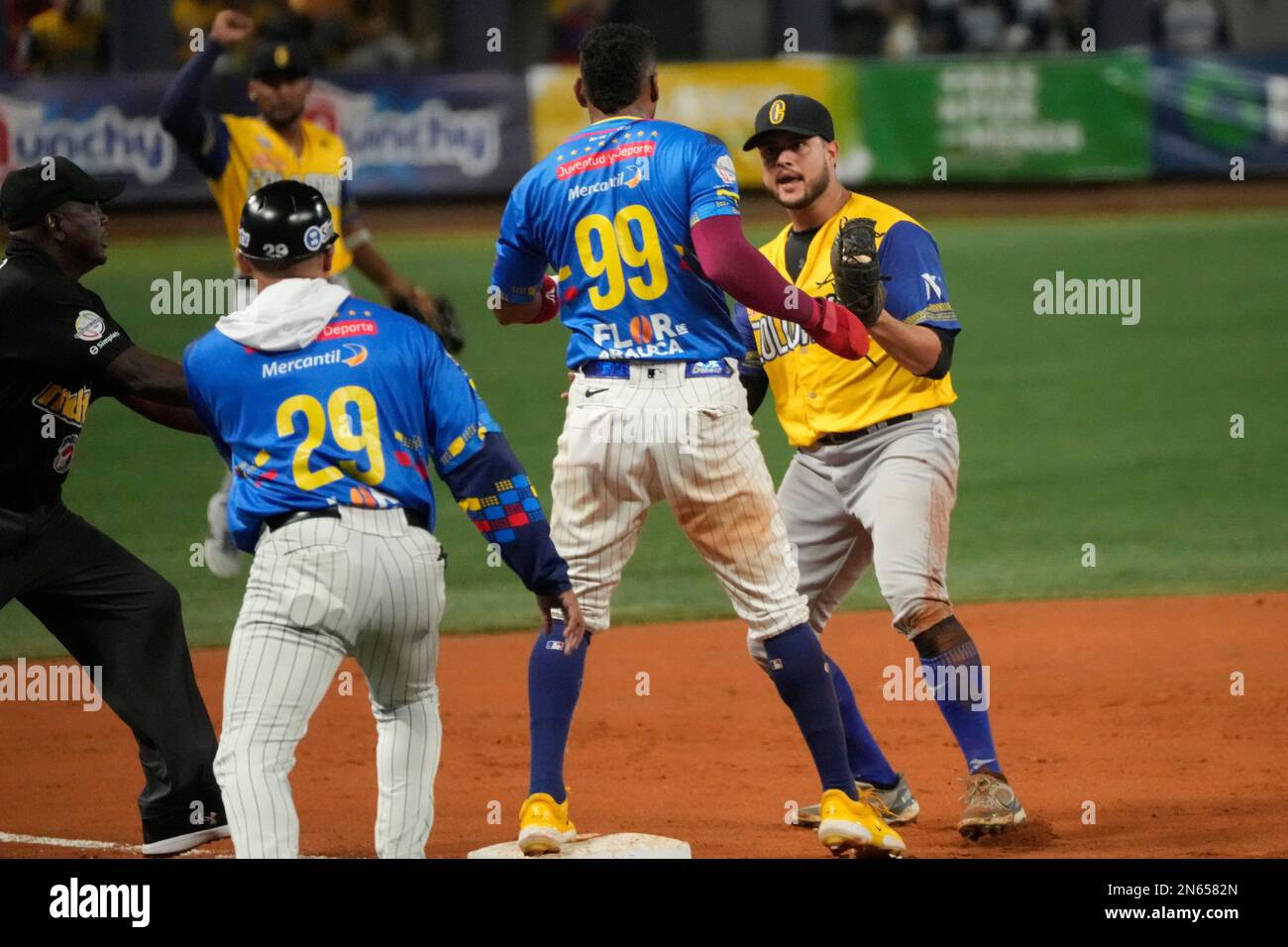 Colombia's third baseman Fabian Pertuz, right, argues with Venezuela's outfielder Danry Vasquez ...