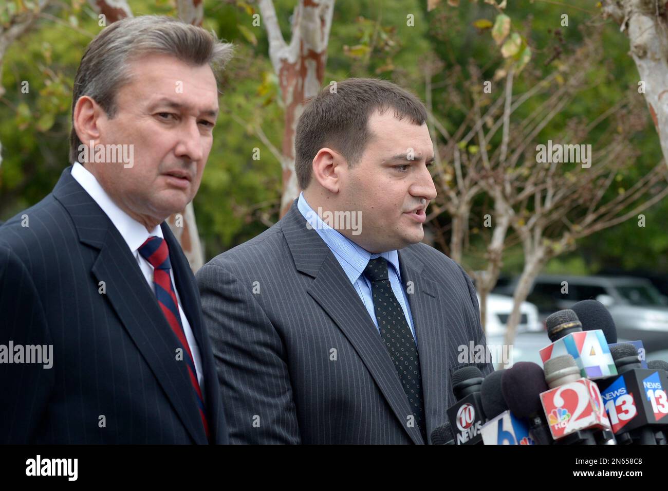 Public defenders Jeff Dowdy, left, and Daniel Megaro answer questions ...
