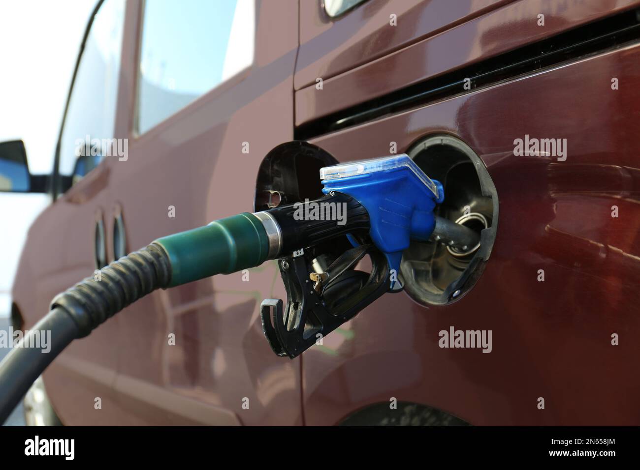 Modern car refilling with fuel at gas station, closeup Stock Photo - Alamy
