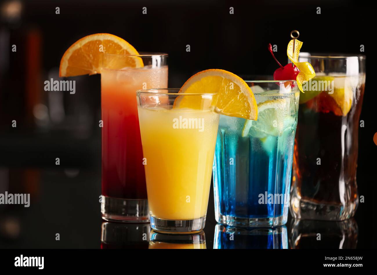 Different delicious cocktails on counter in bar Stock Photo - Alamy