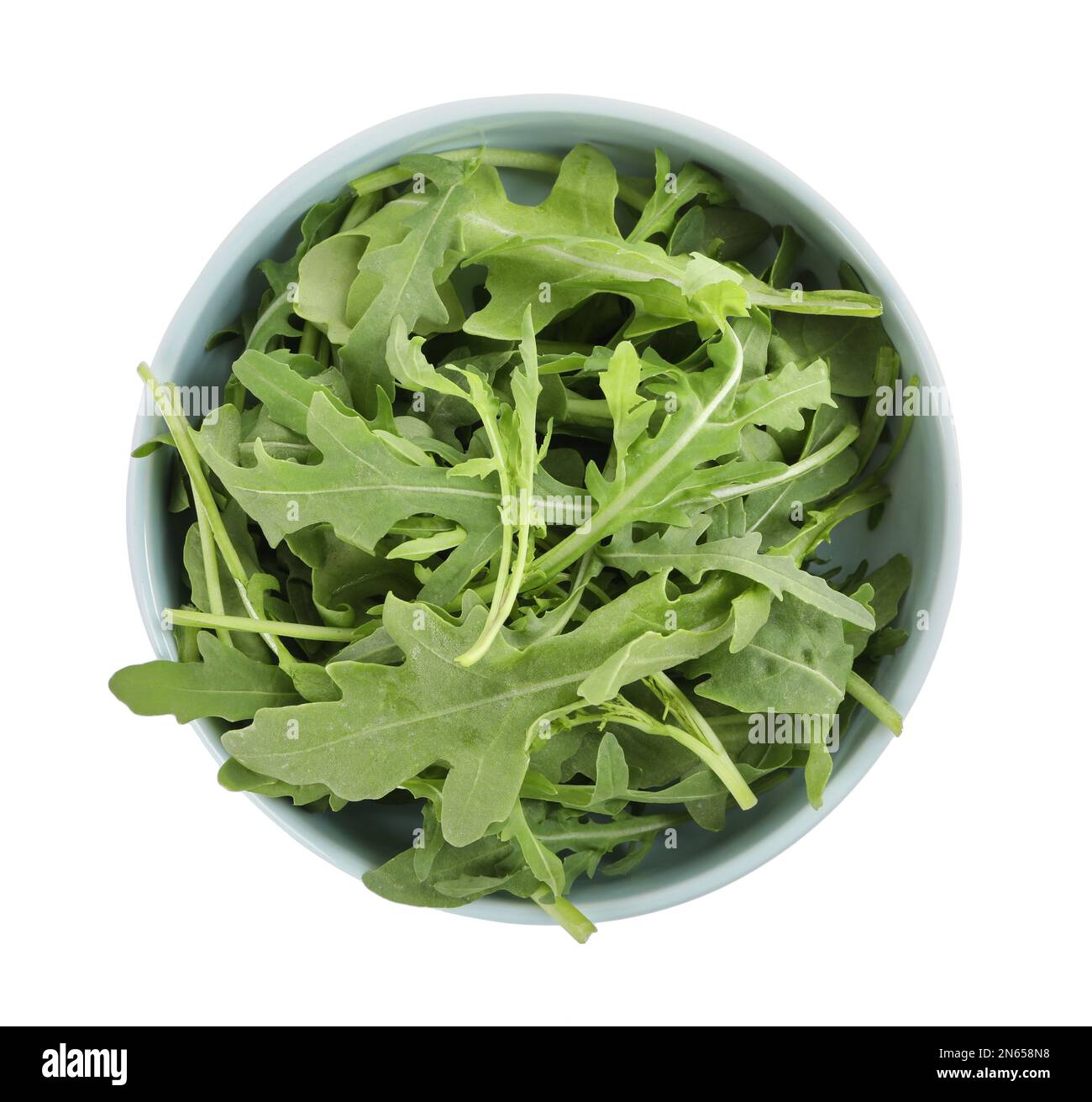 Delicious fresh arugula in bowl isolated on white, top view Stock Photo ...