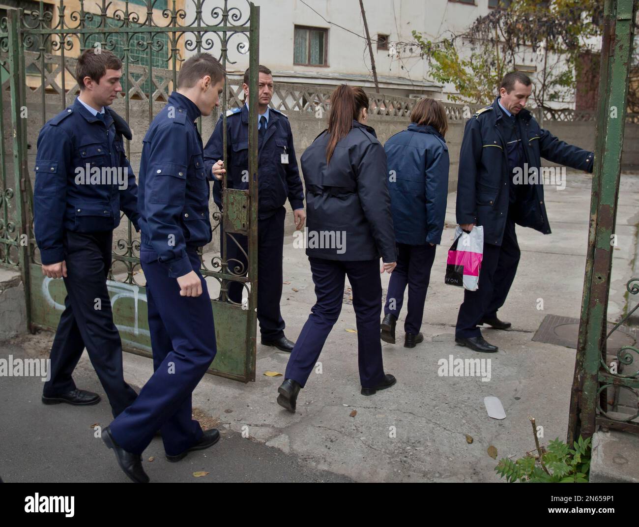 Romanian police academy students arrive at a court where the trial of ...