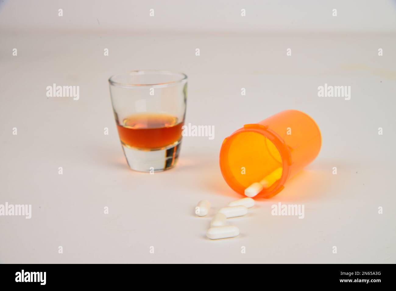 Containers of controlled substances on white background, symbols of ...