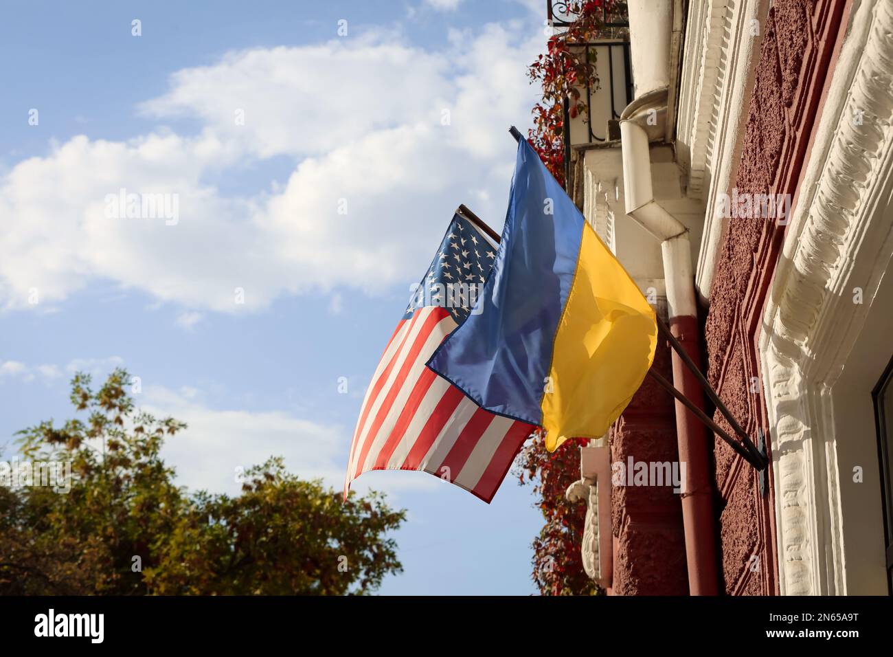 Flags of Ukraine and USA on building facade Stock Photo - Alamy
