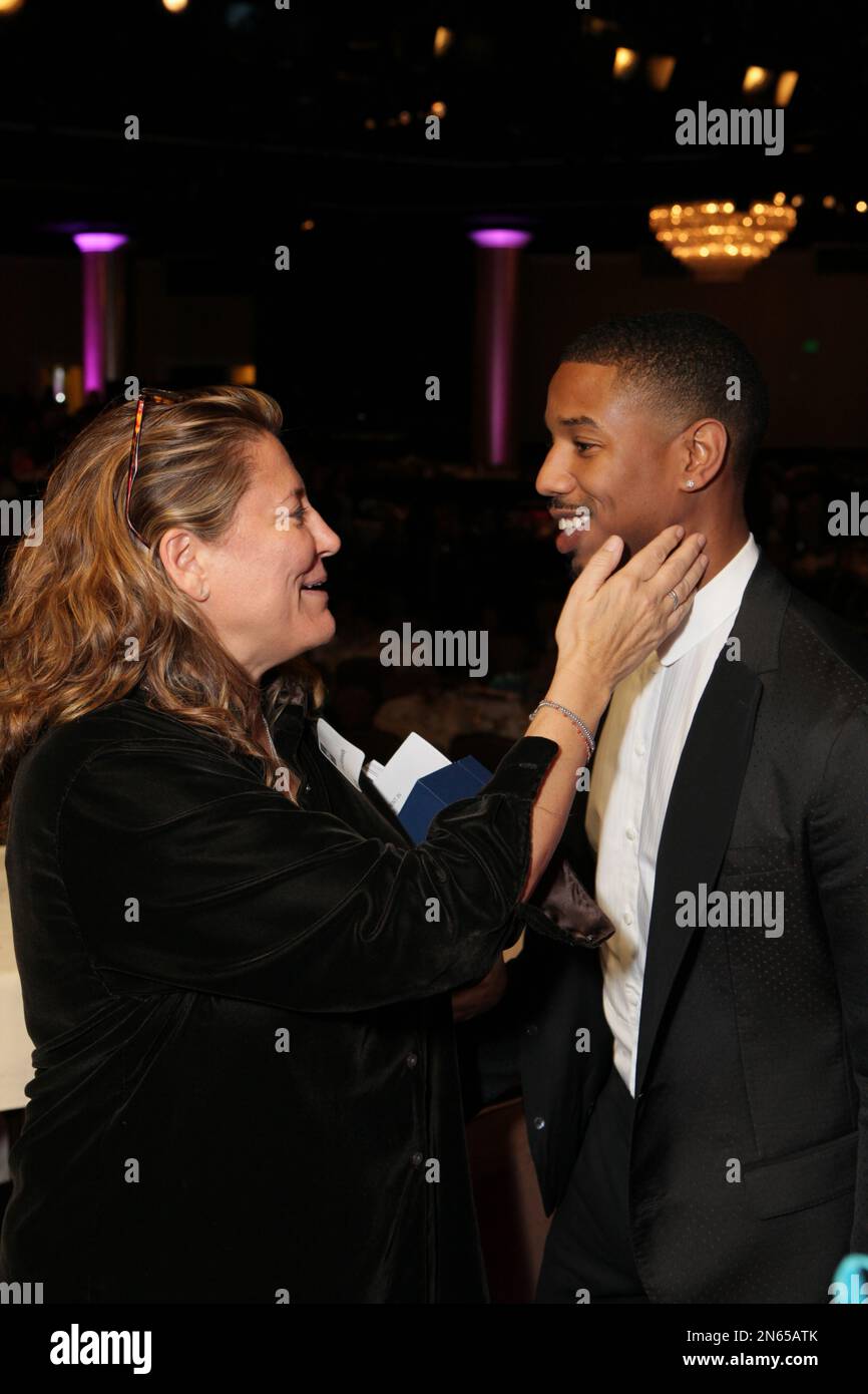 From left, Lora Kennedy greets actor Michael B. Jordan during the ...